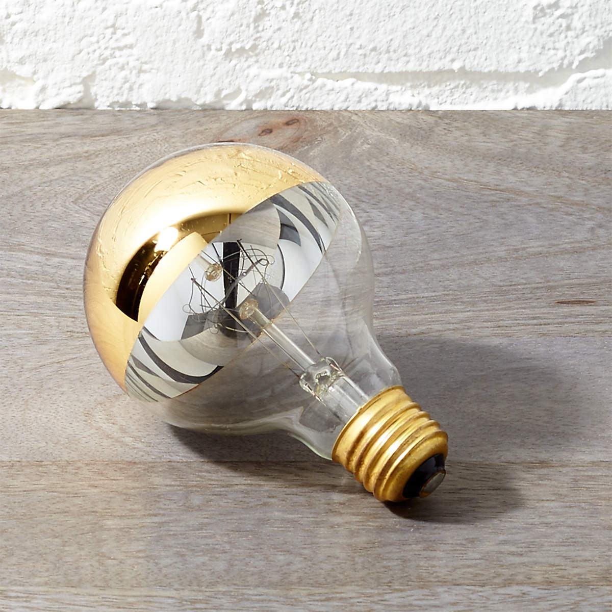 G25 Gold Tipped 60W Modern Light Bulb + Reviews | CB2