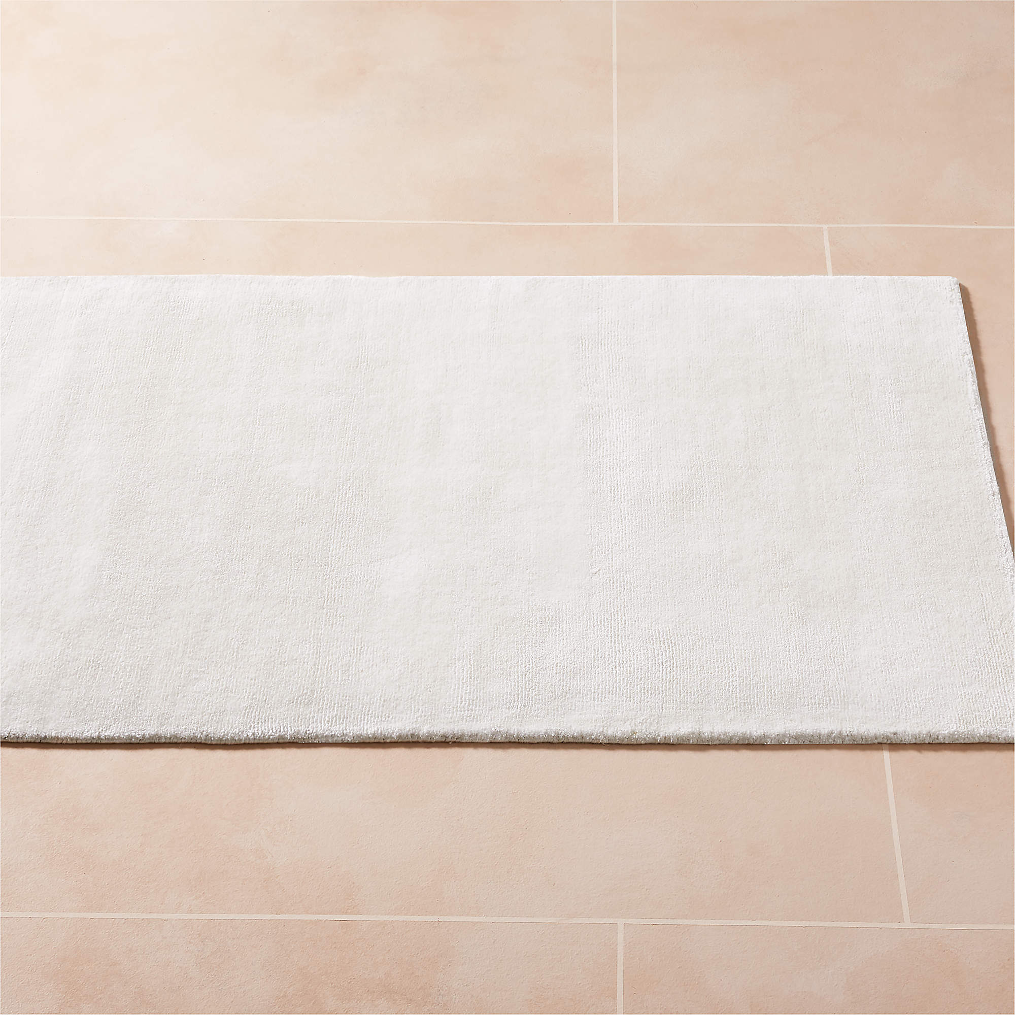 Kole Warm White Solid Performance Nylon Area Rug | CB2