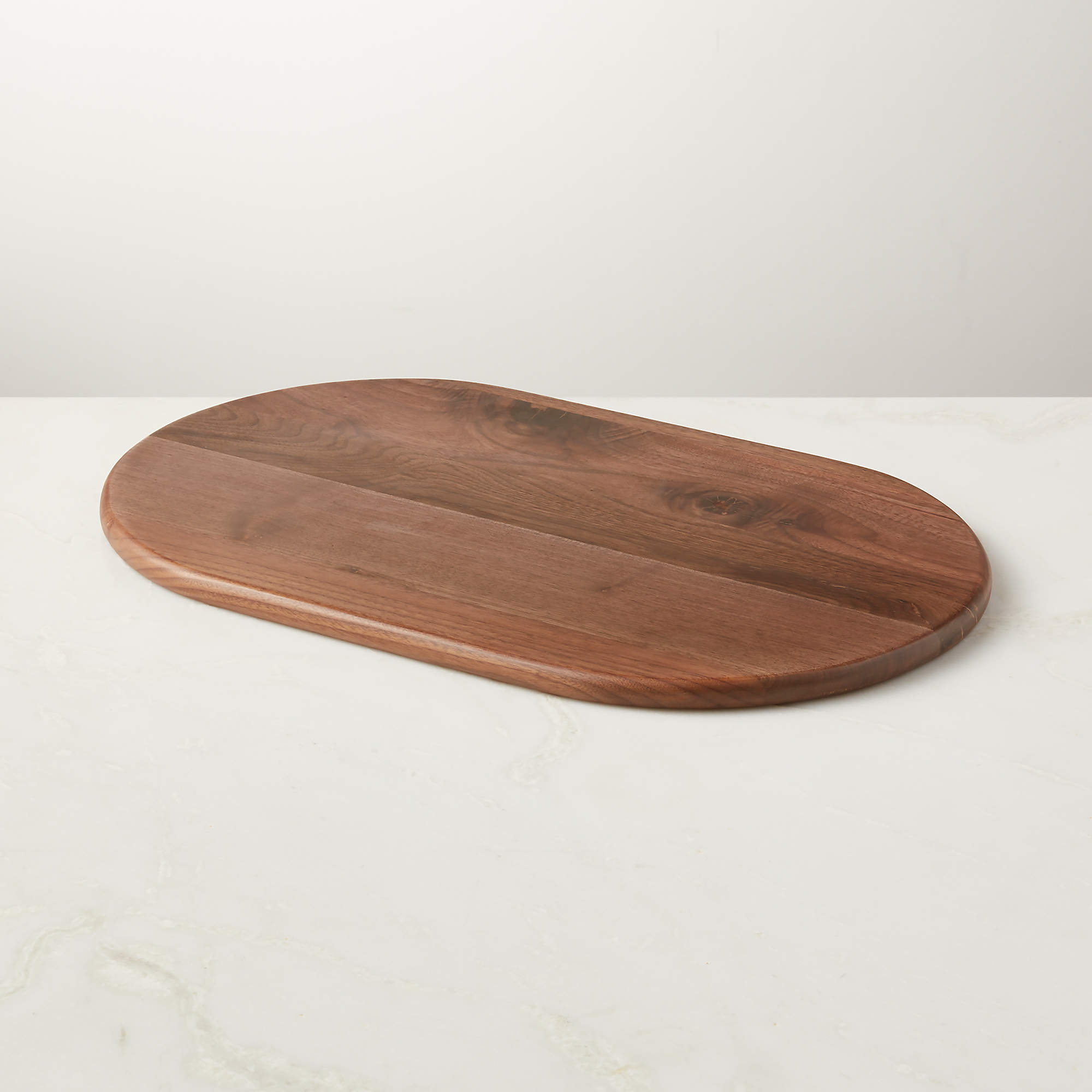 Piero Oval Walnut Serving Board by Gianfranco Frattini | CB2